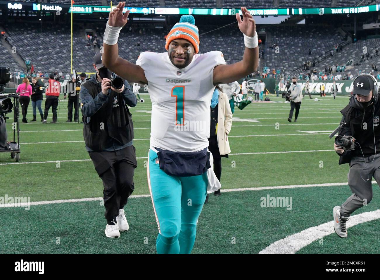 Miami Dolphins quarterback Tua Tagovailoa celebrates as he leaves the ...