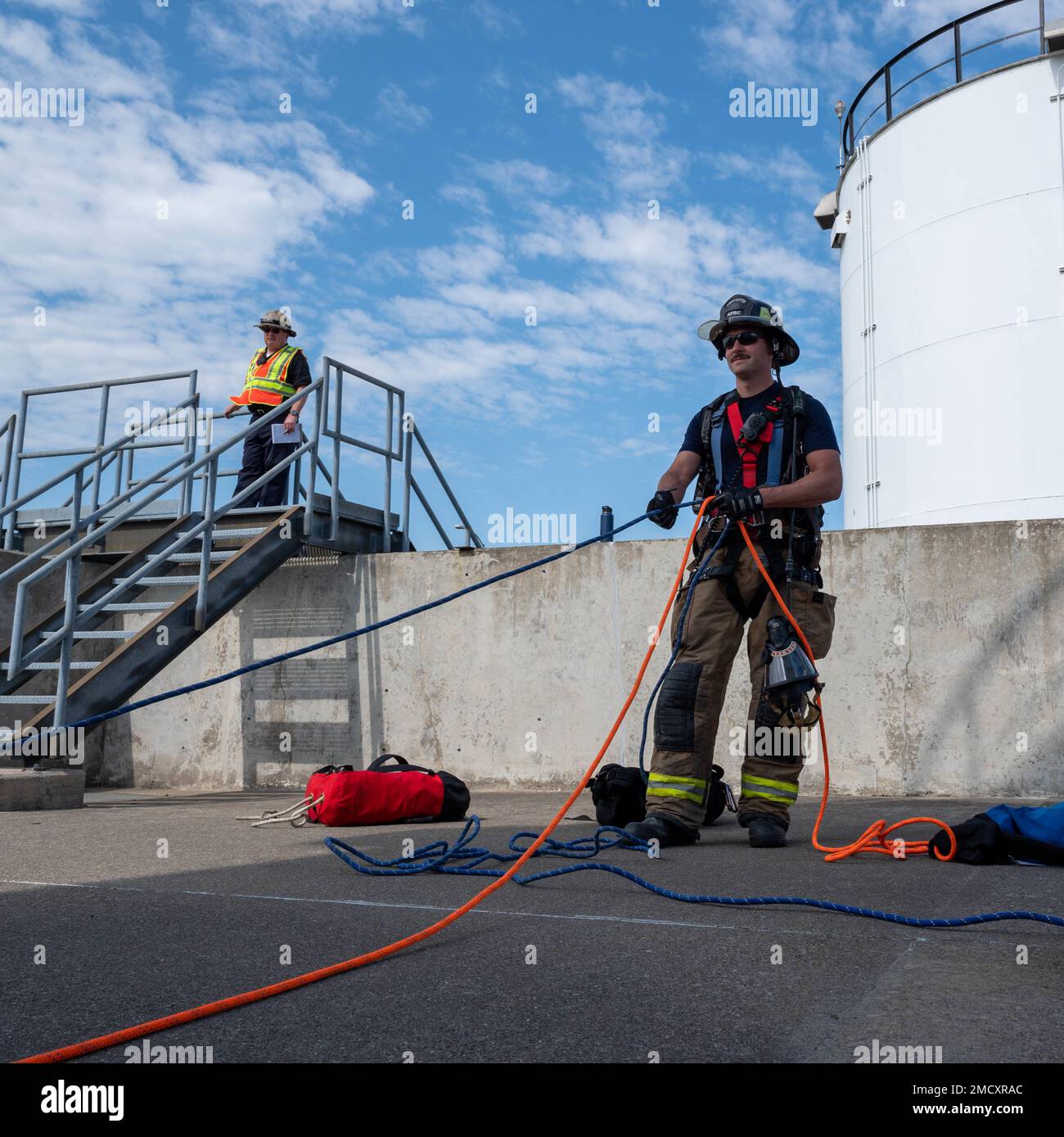 Tim Zack, with the 914th Fire Emergency Services, holds two ropes used ...