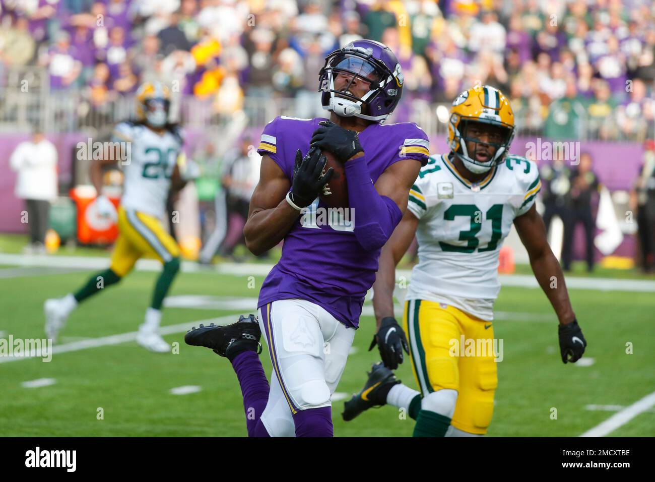 Minnesota Vikings wide receiver Justin Jefferson catches a pass ahead ...