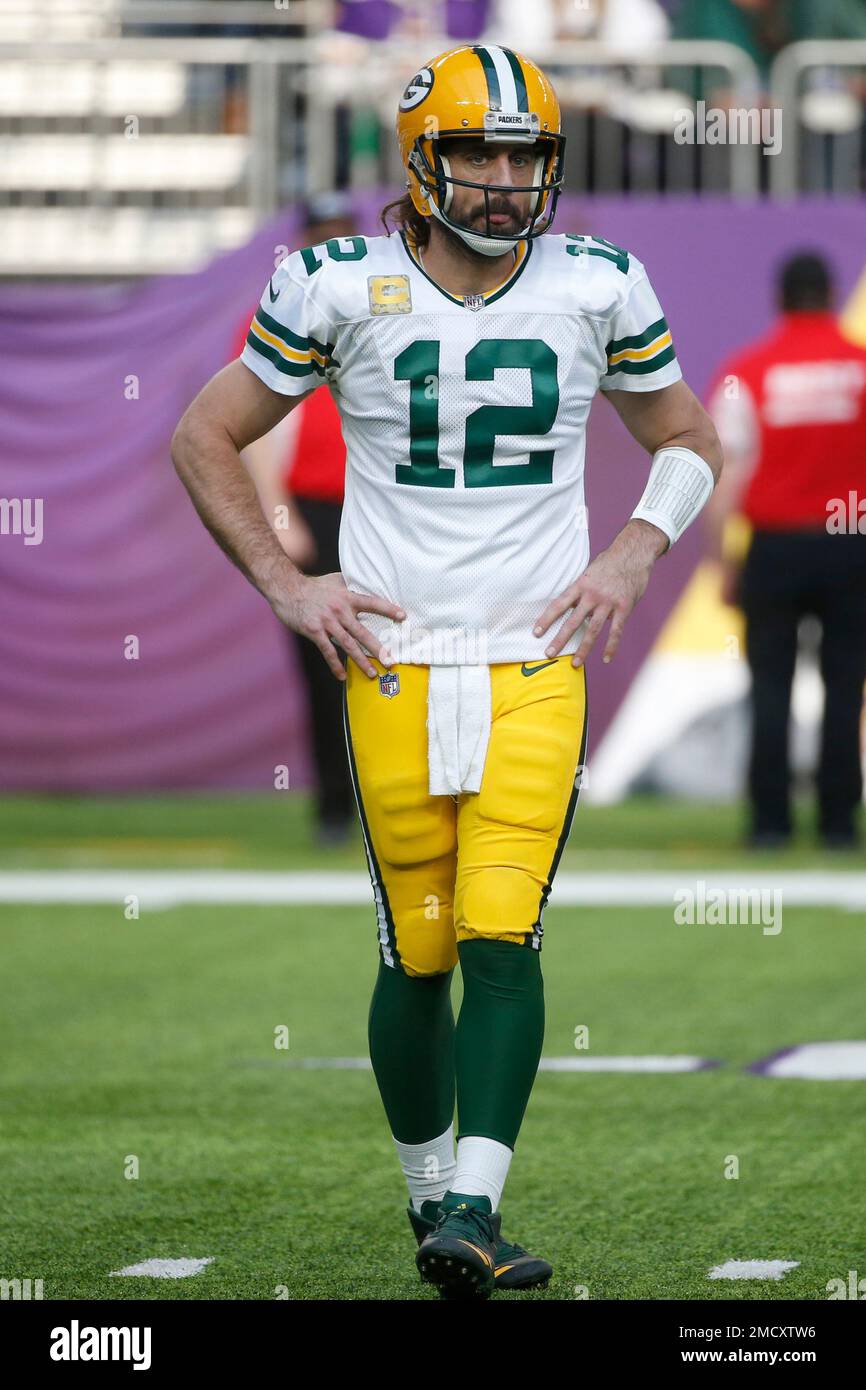 Green Bay Packers quarterback Aaron Rodgers (12) walks on the field ...