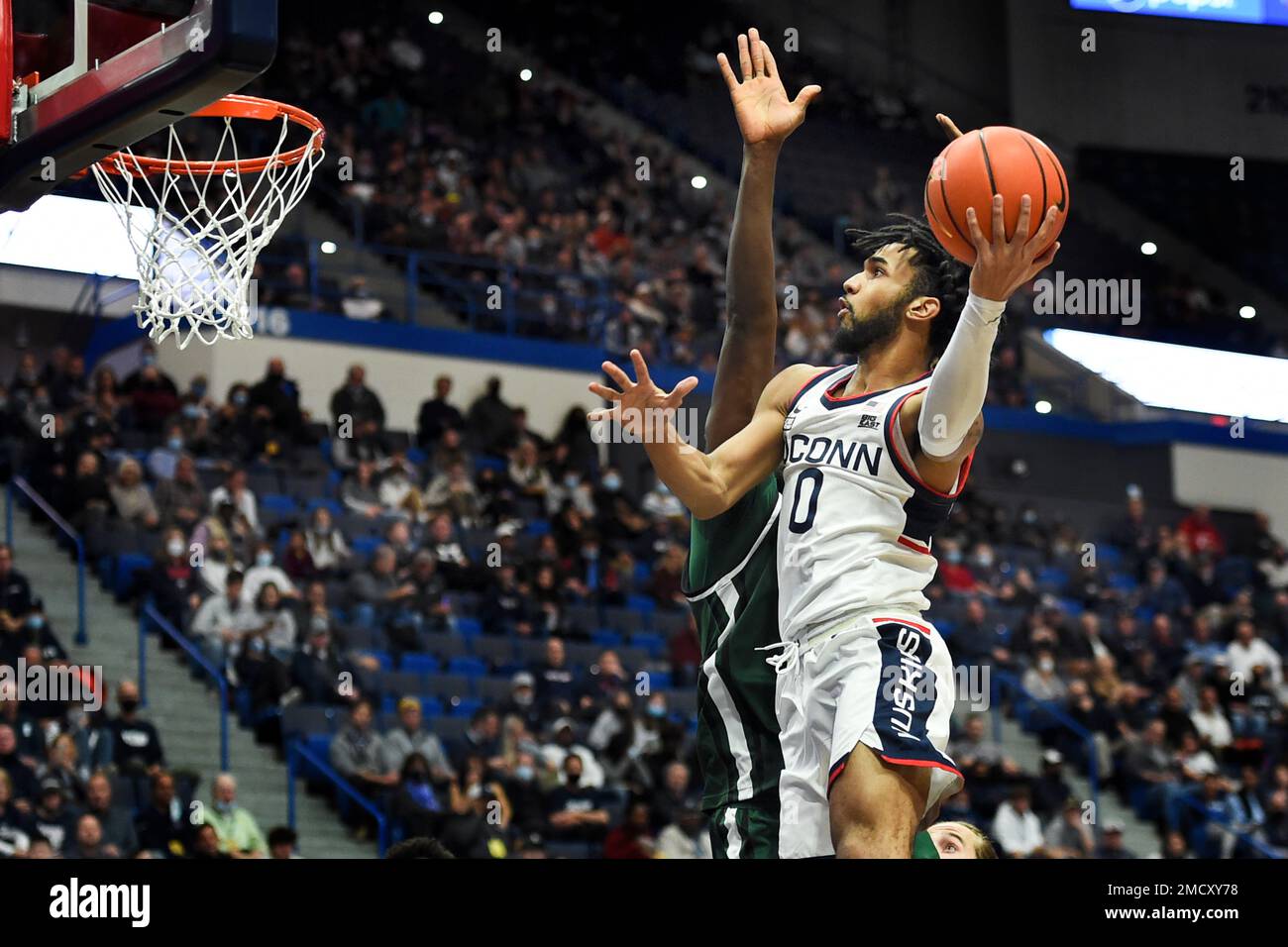 Connecticut's Jalen Gaffney (0) shoots during the first half of an NCAA ...