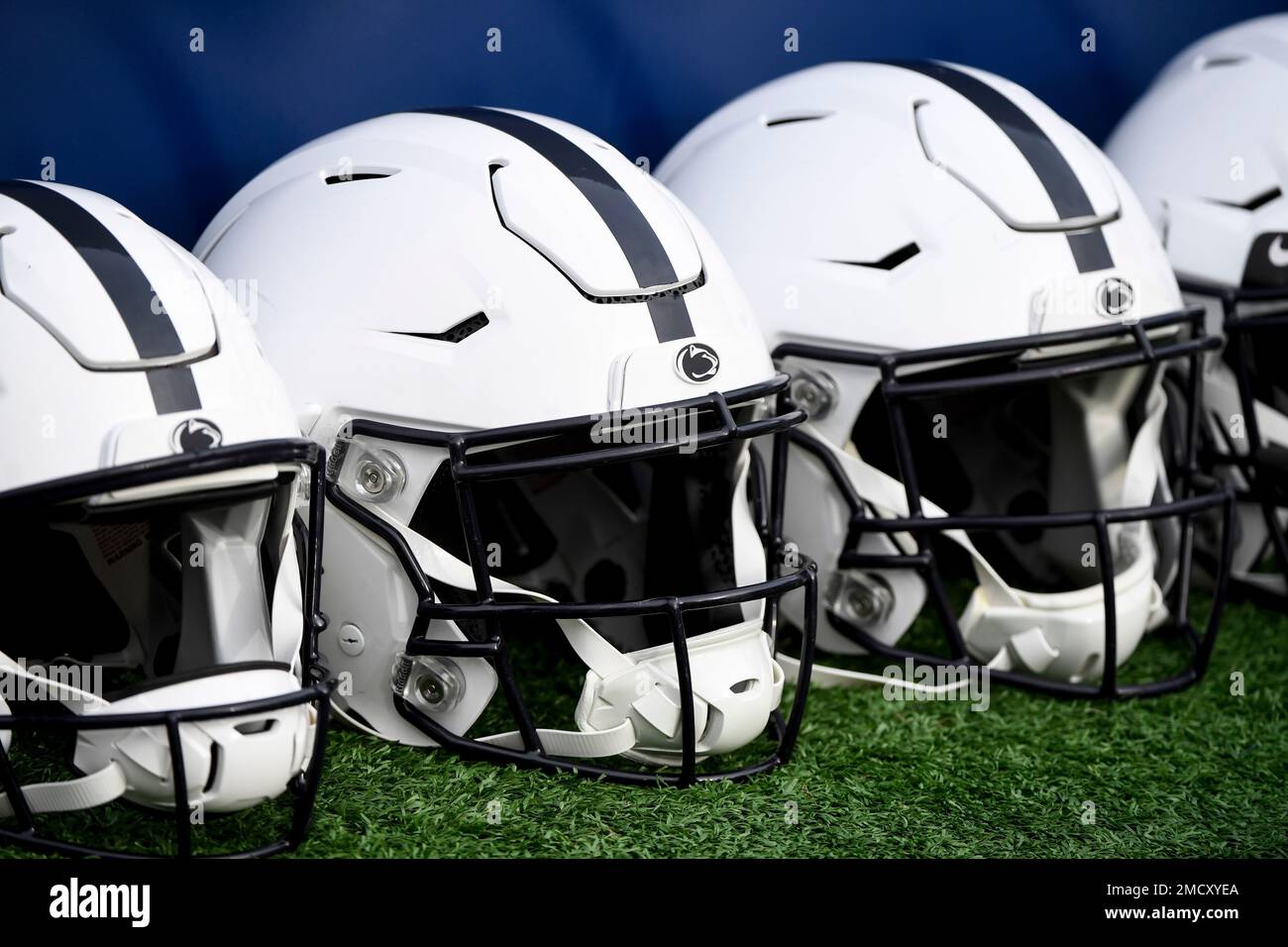 Penn State football helmets sit on the sideline during an NCAA college ...