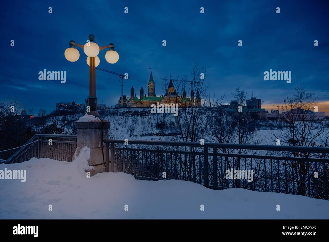 The snowy Ottawa at night with the Parliament hill building complex ...