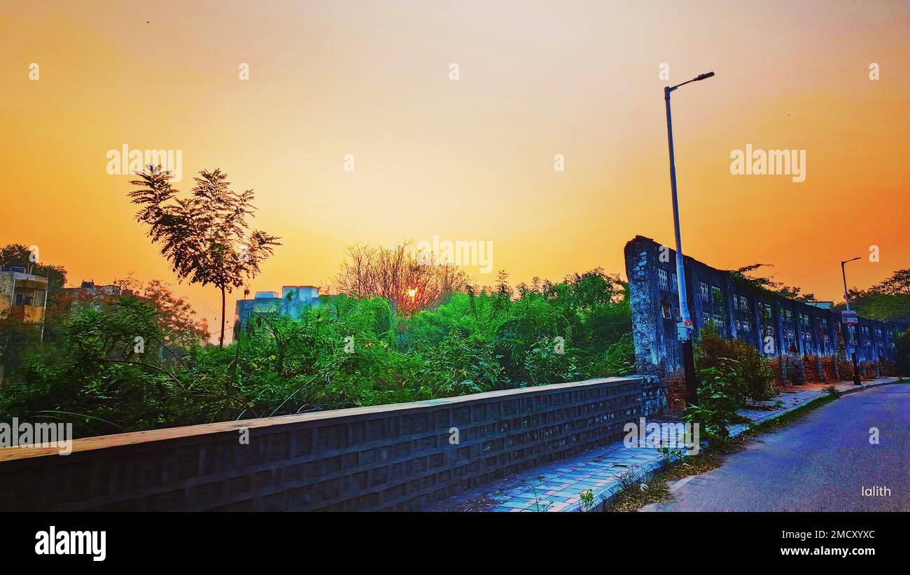 The beautiful early morning sunrise captured in a town in India Stock ...