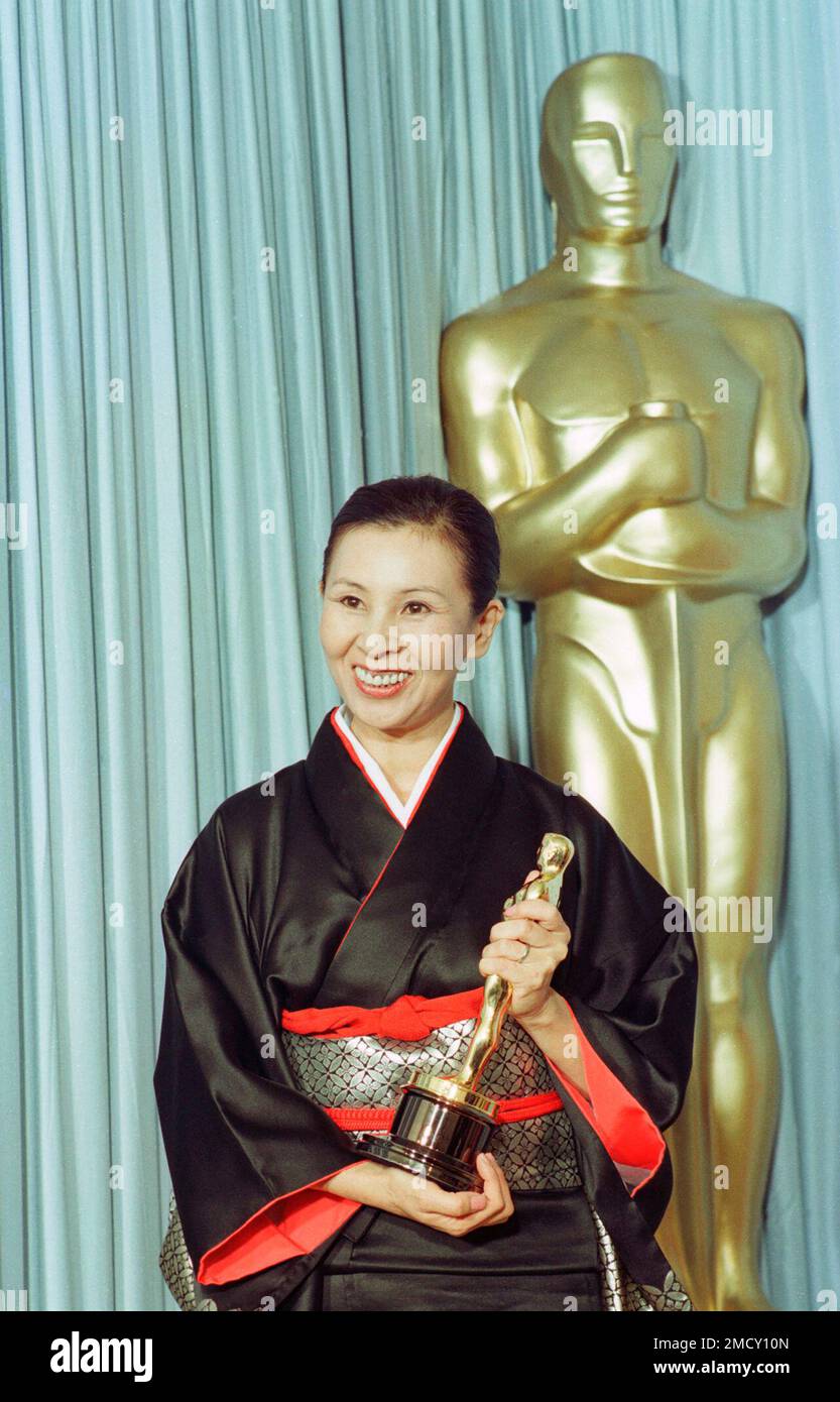 FILE - Emi Wada holds Oscar she received for achievement in costume design for movie "Ran," at ...