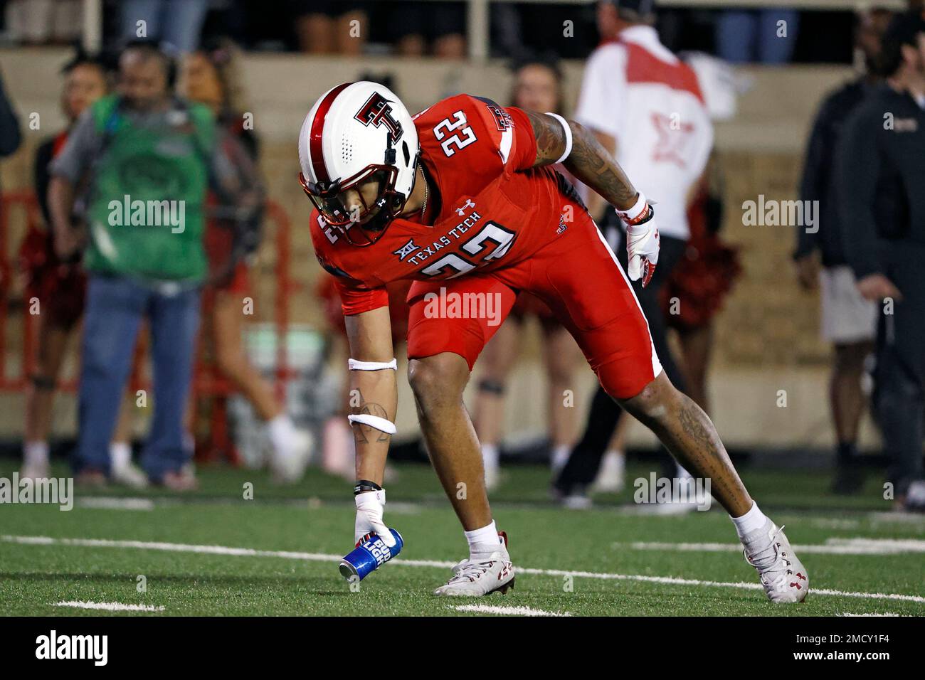 Texas Tech's Reggie Pearson Jr. (22) grabs a beer can that was thrown ...