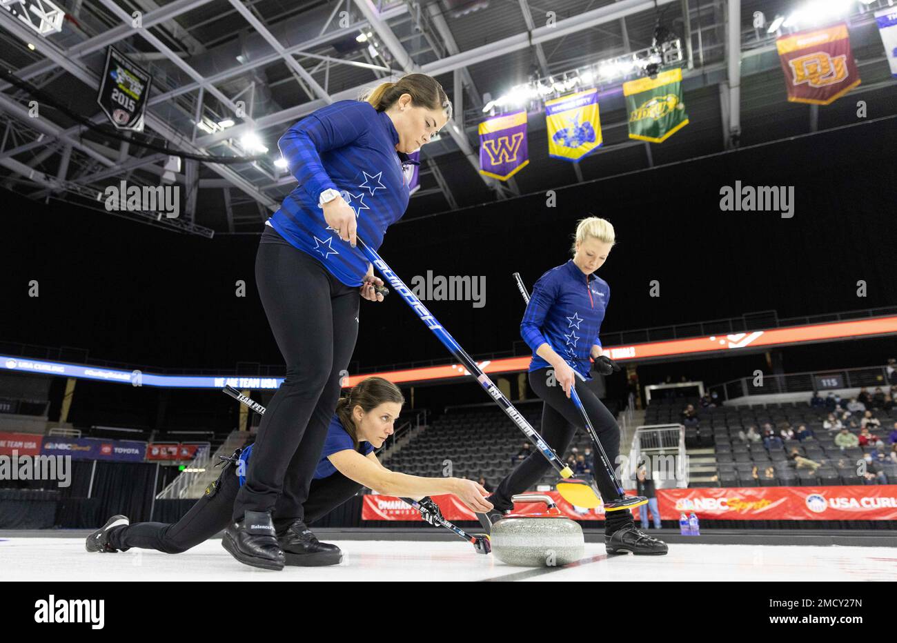 Team Peterson's Tara Peterson, center, throws the rock as Becca ...
