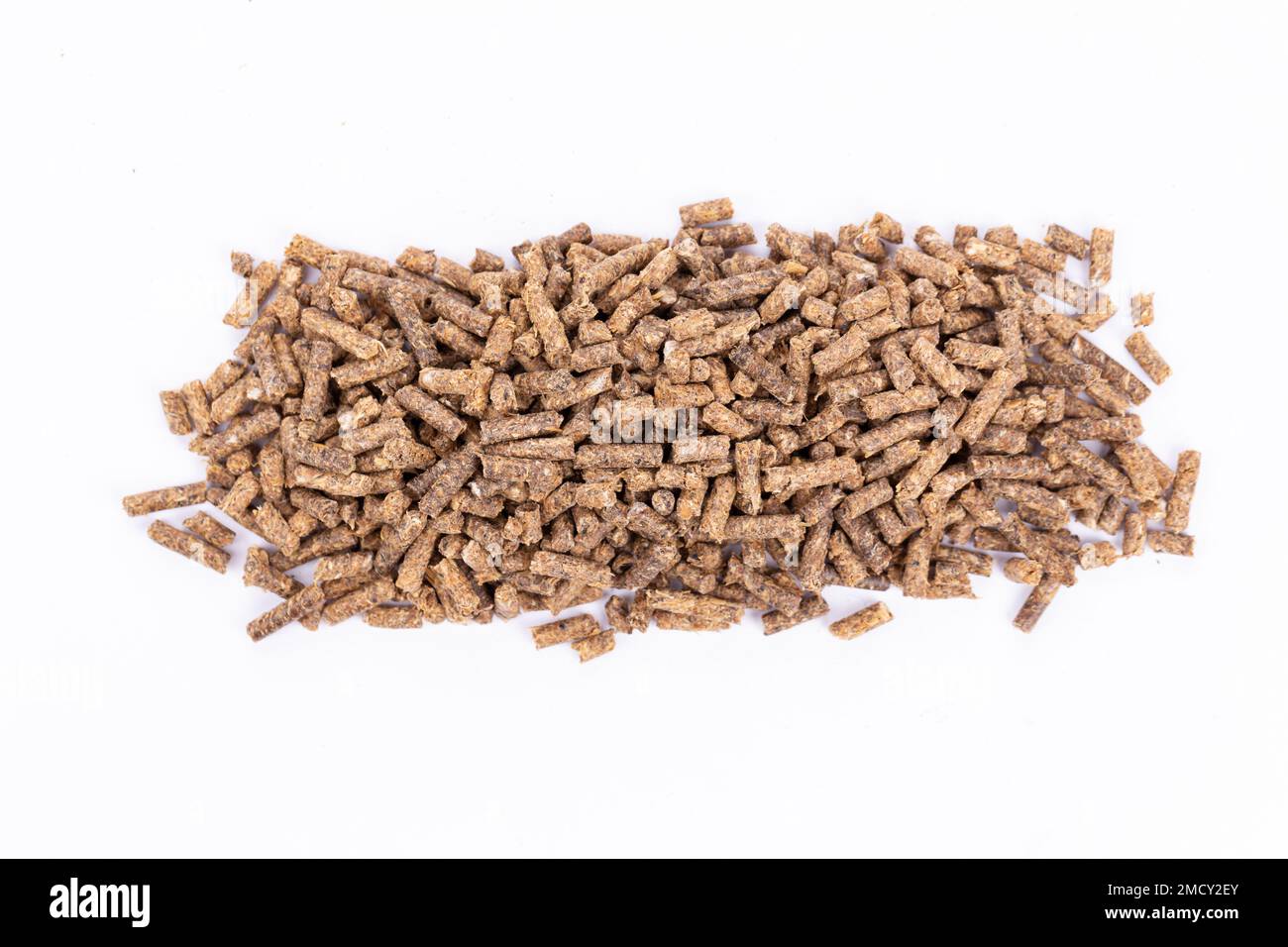 Sunflower granulated feed on white background, close-up. Pile of ...