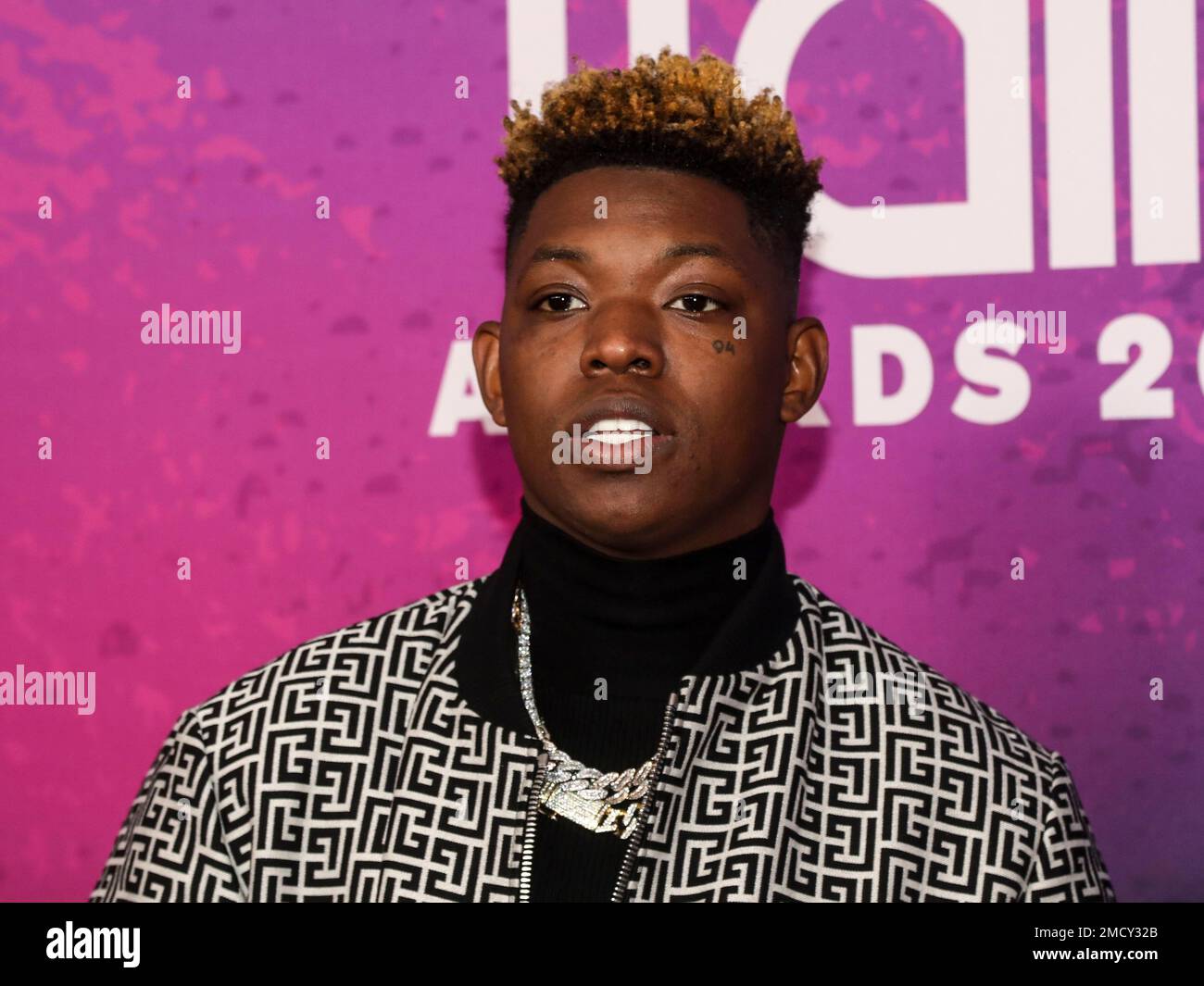 Recording artist Yung Bleu attends 2021 Soul Train Awards red carpet at ...