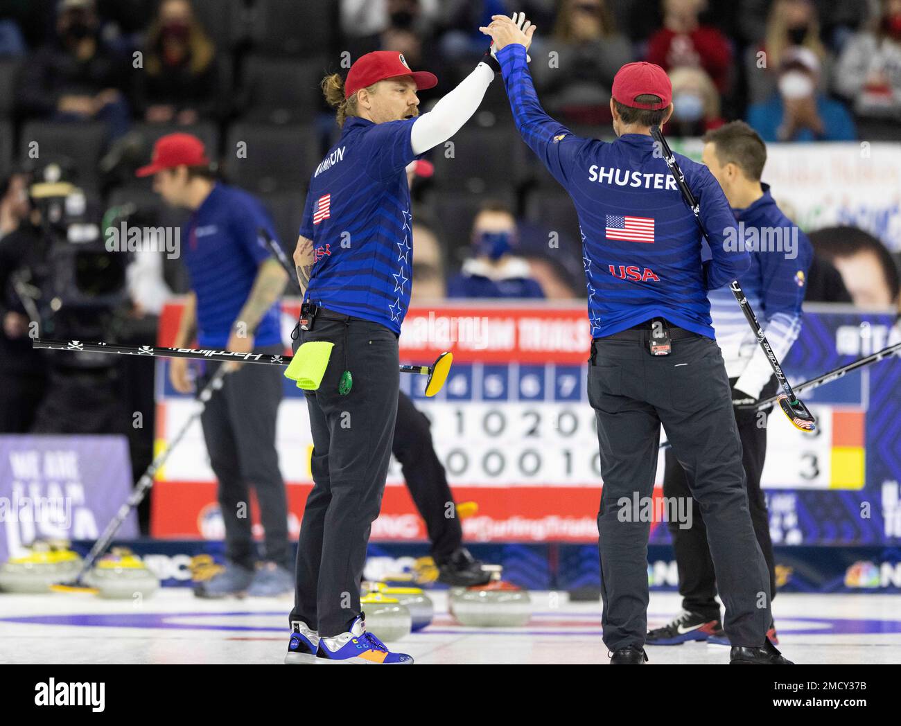 Team Shuster's Matt Hamilton, left, high-fives John Shuster in ...
