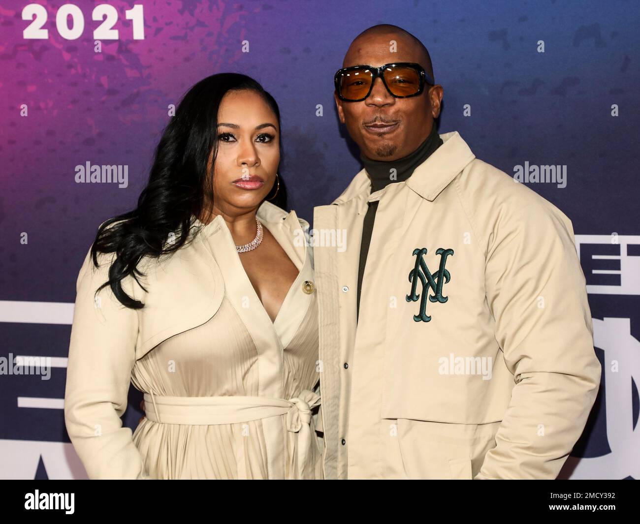 Aisha Atkins, left, and recording artist Ja Rule, right, attend the ...