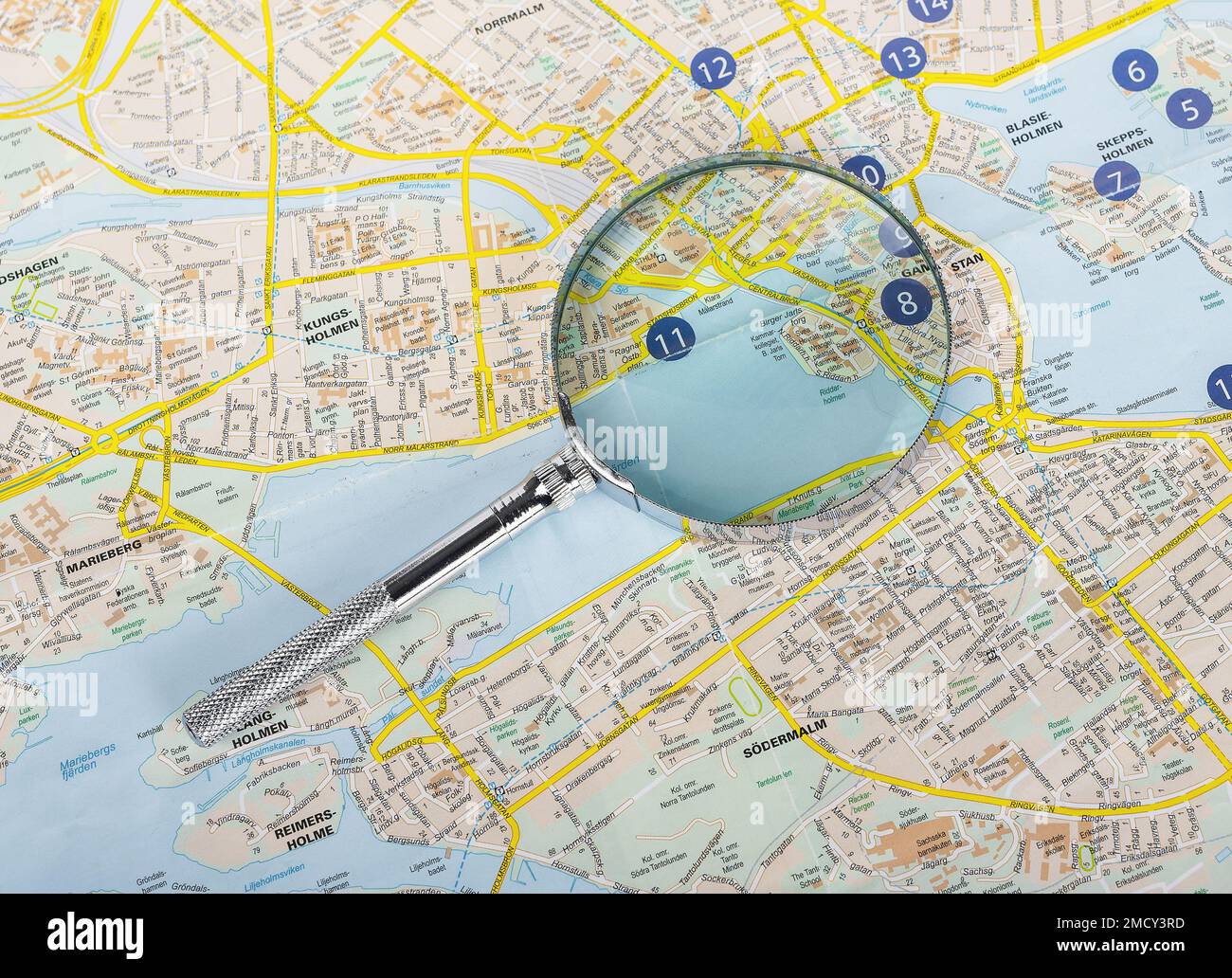 Travel, tourism, geography concept. Map with magnifier over it for ...