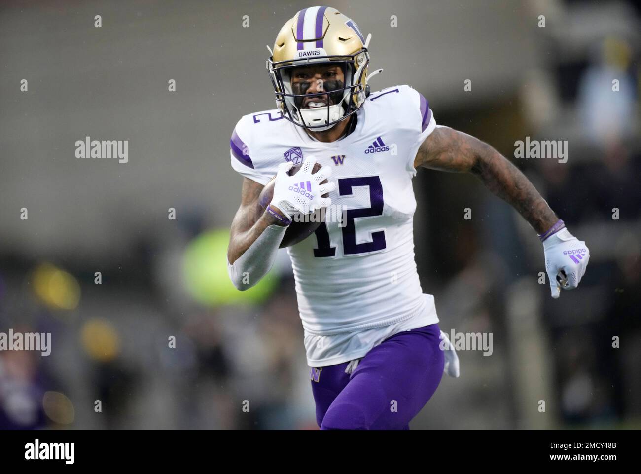 Washington wide receiver Ja'Lynn Polk runs for a touchdown after making ...