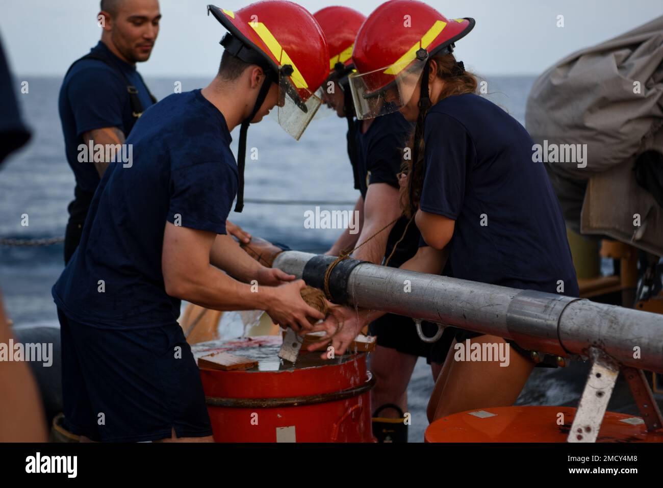 U.S. Coast Guard Ensign John Stone, left, and Ensign Katherine Pittman ...