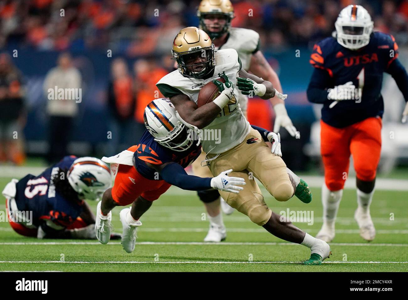 UAB running back DeWayne McBride (22) is hit by UTSA safety Antonio ...