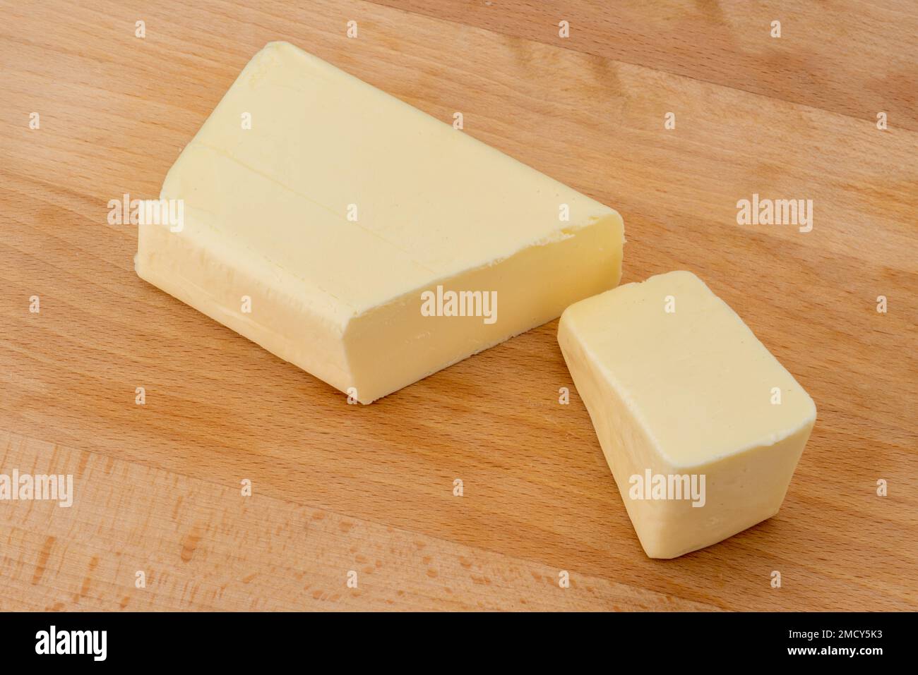 Block of butter cut on wooden cutting board Stock Photo - Alamy