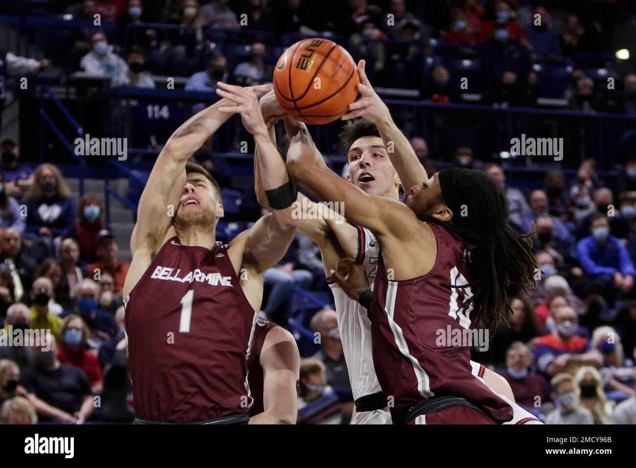 Bellarmine guards Juston Betz, left, and Dylan Penn, right, go after a ...