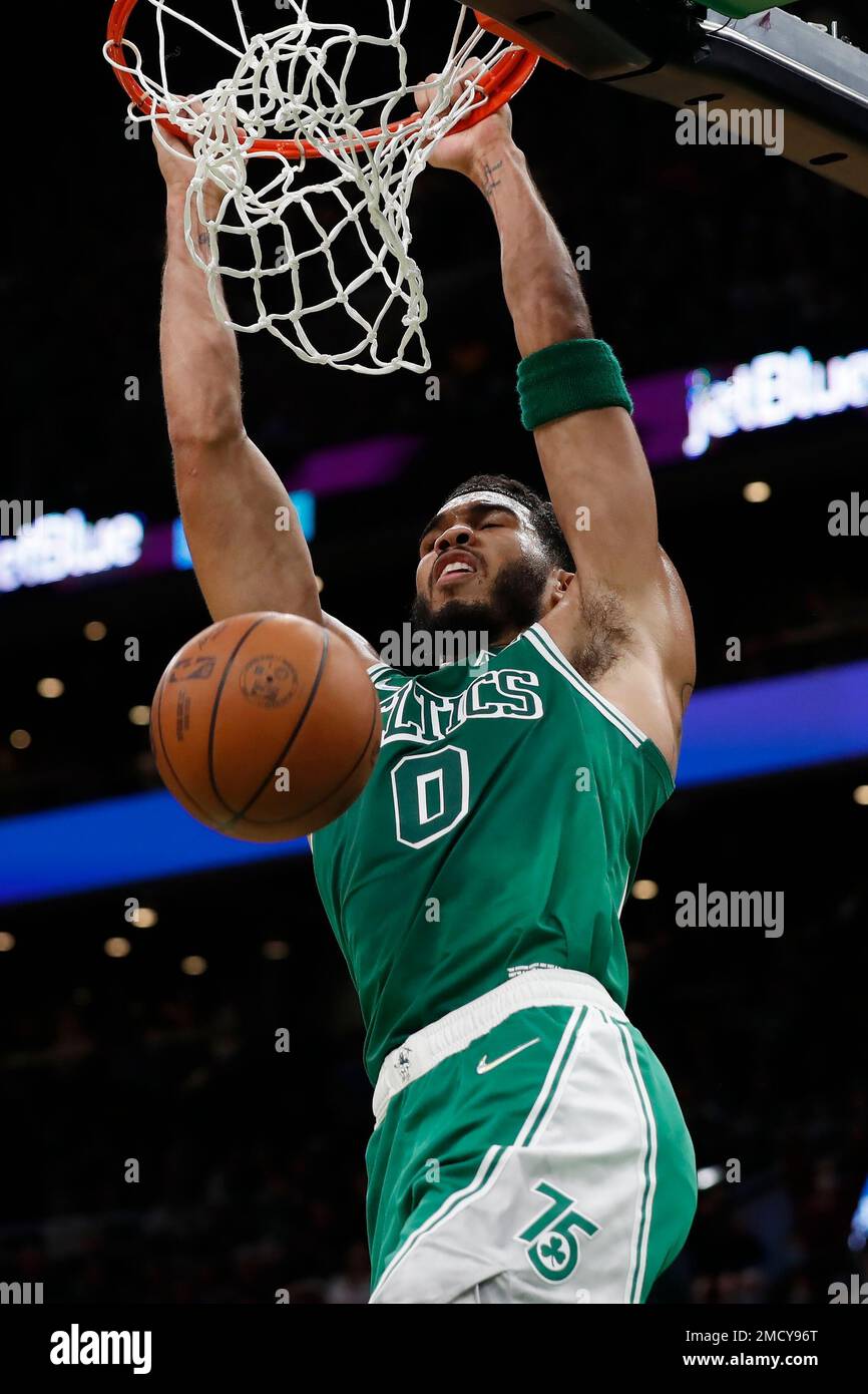Boston Celtics' Jayson Tatum dunks during the first half of an NBA ...