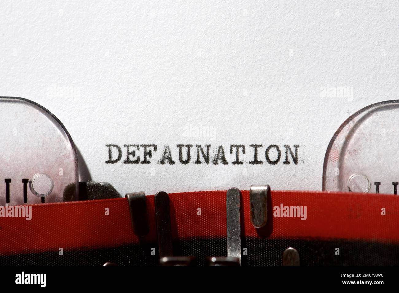 Defaunation word written with a typewriter Stock Photo - Alamy