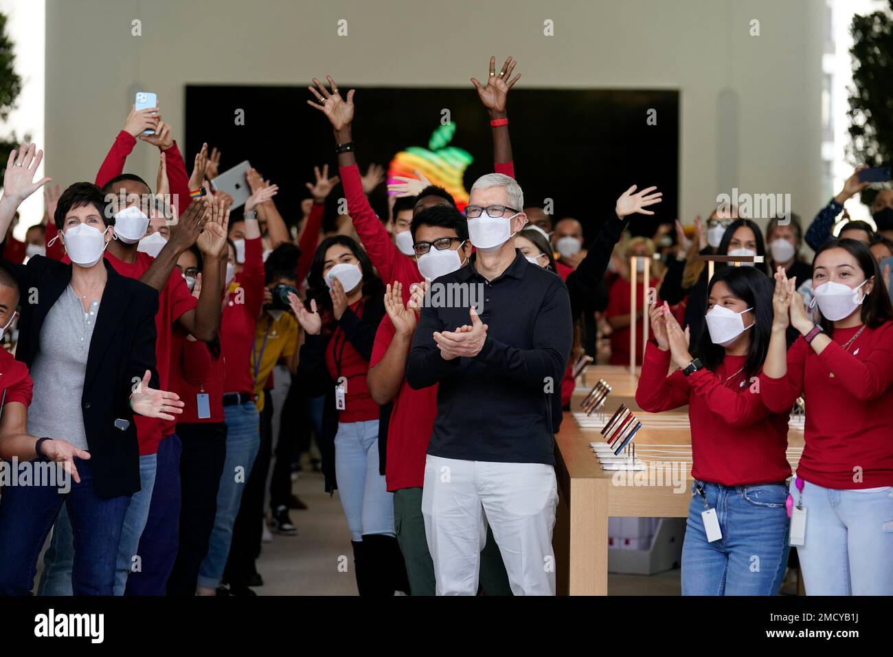 Apple CEO Tim Cook, center, and Deirdre O'Brien, at left, senior vice ...