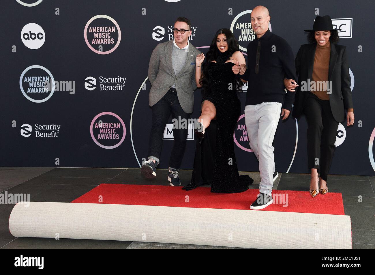 Adam Stotsky, from left, Cardi B, Jesse Collins and Dionne Harmon roll ...