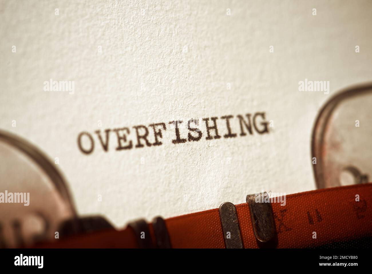 Overfishing word written with a typewriter Stock Photo - Alamy