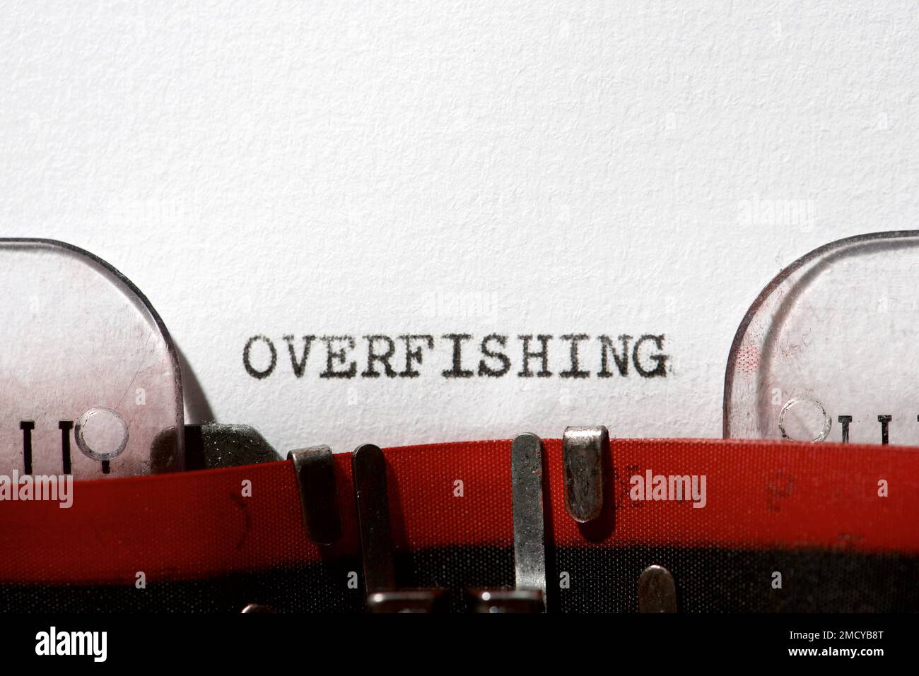 Overfishing word written with a typewriter Stock Photo - Alamy