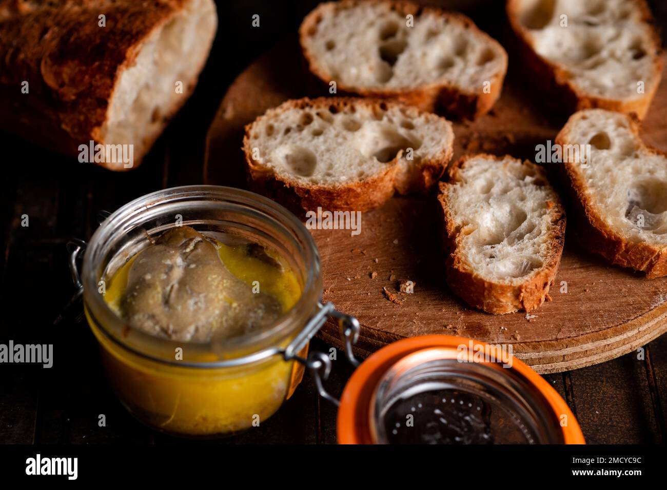 jar of foie gras and French baguette wedges. Preparing canapes Stock ...