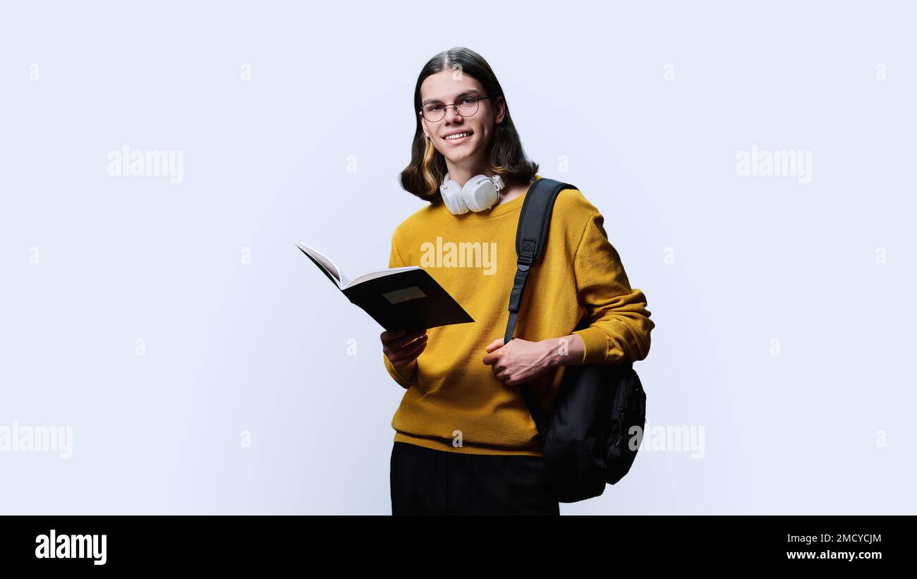 Portrait of teenage student guy on white studio background Stock Photo ...