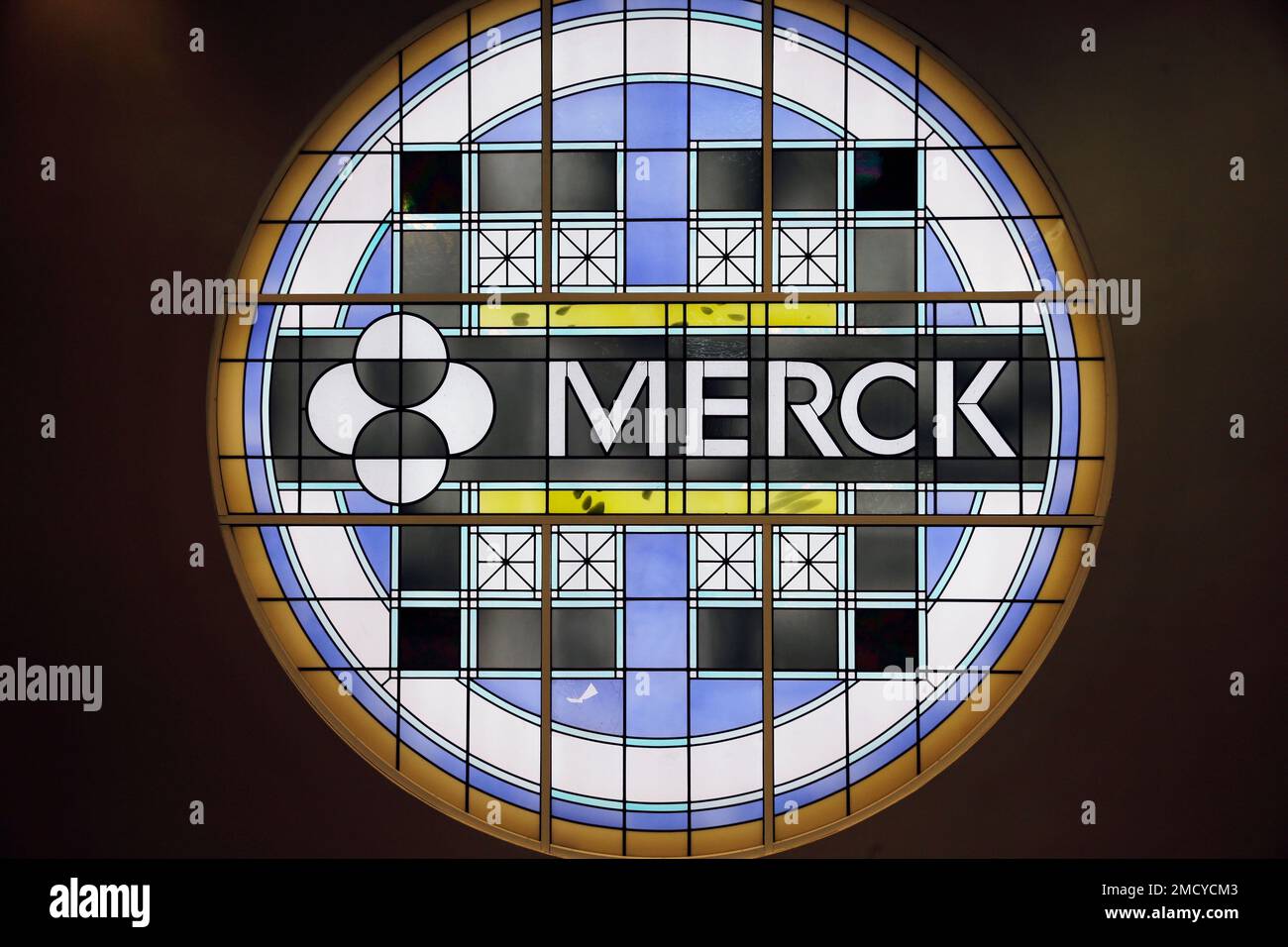 FILE - the Merck logo on a stained glass panel at a Merck company ...