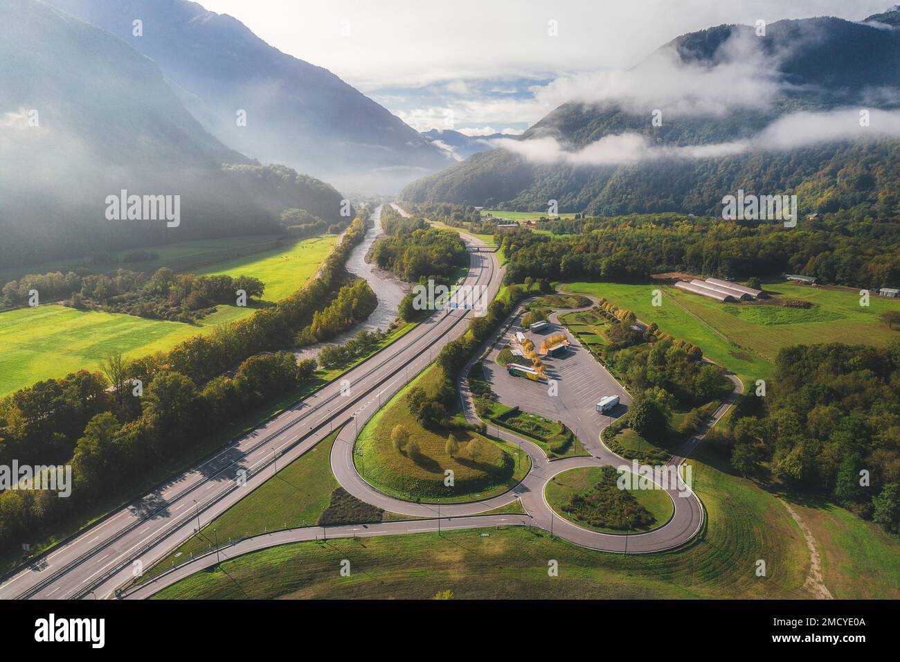 Aerial view of natural landscapes and highway asphalt road along lakes ...