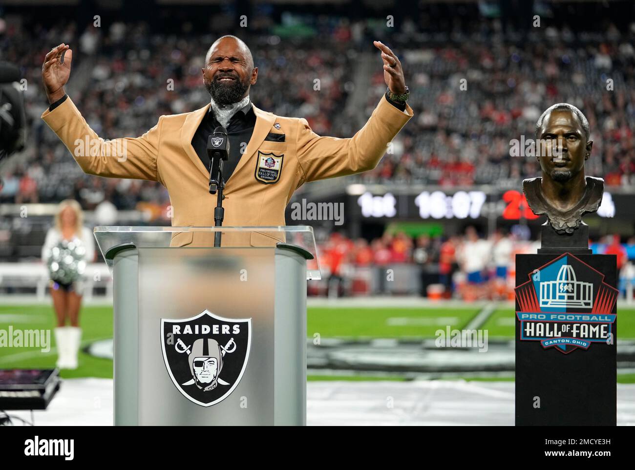 NFL Pro Football Hall of Fame inductee Charles Woodson is honored prior to an NFL football game ...