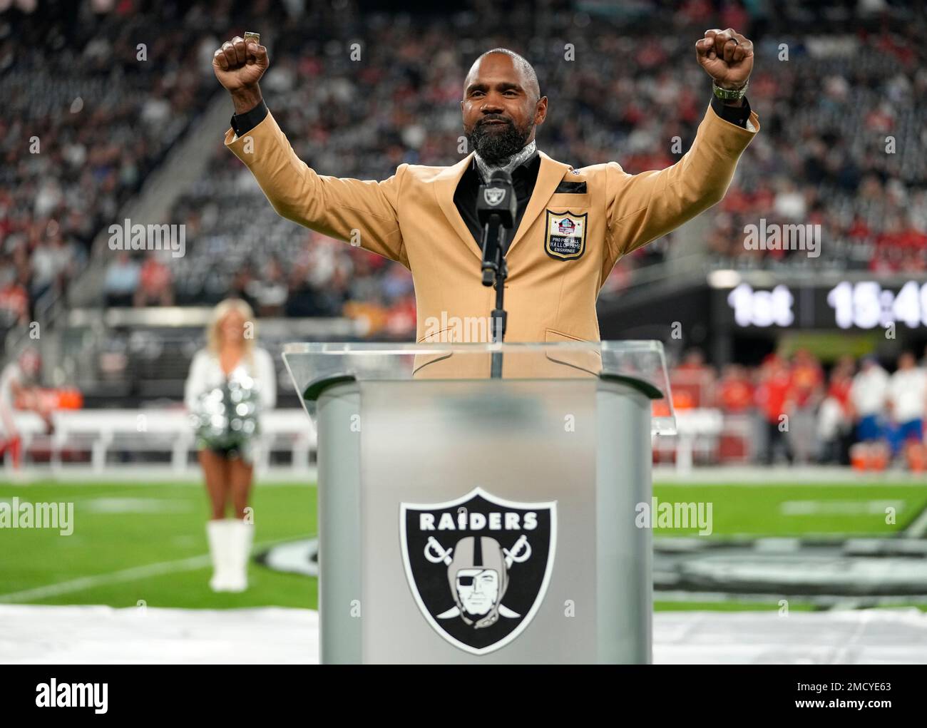 NFL Pro Football Hall of Fame inductee Charles Woodson is honored prior to an NFL football game ...