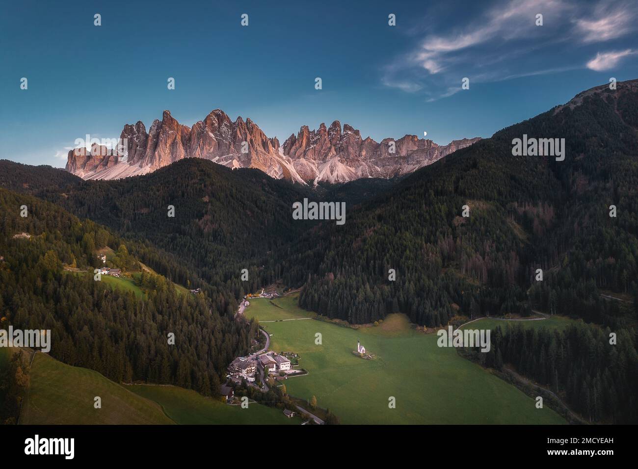 Aerial view of the beautiful small village in Val di Funes, with church ...