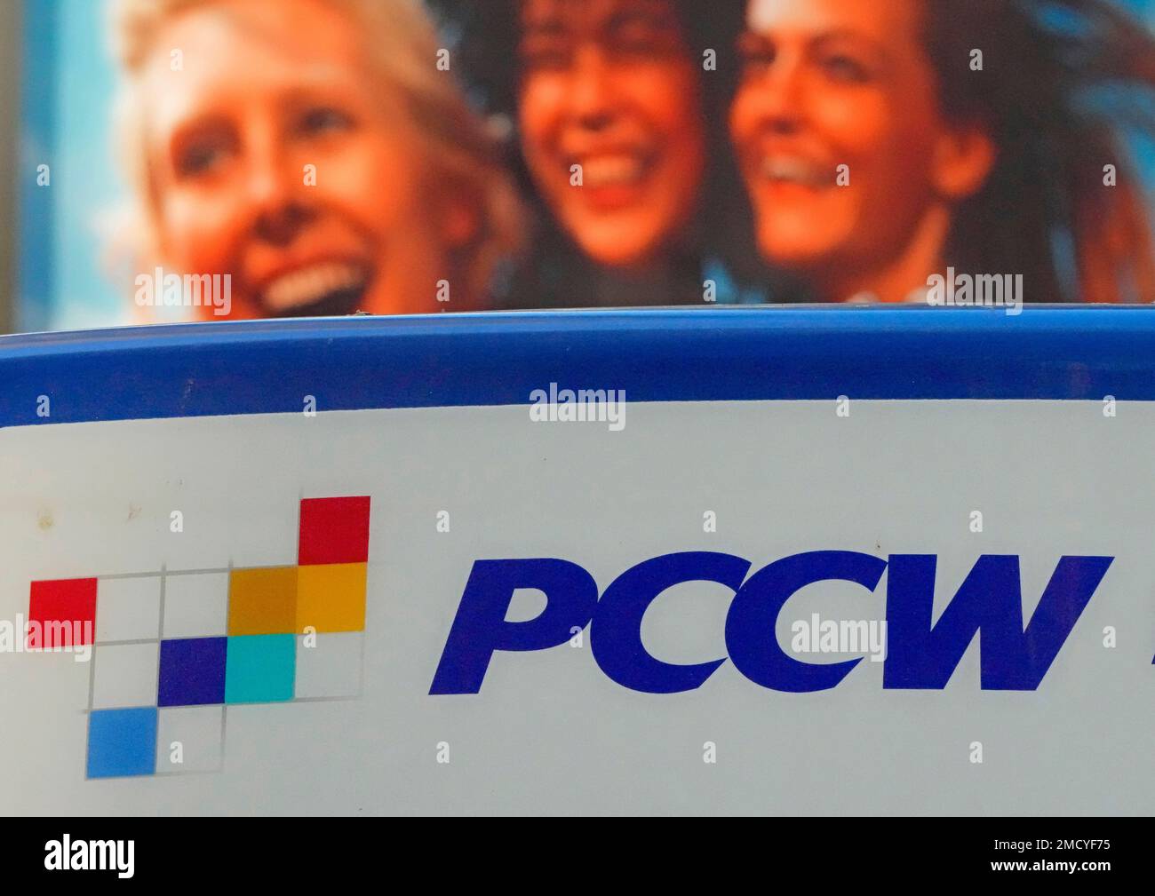 PCCW Limited logo is displayed at a phone box in Hong Kong, Thursday ...