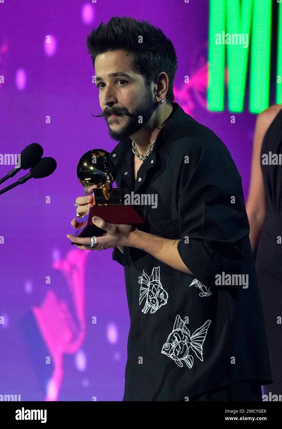 Camilo accepts the award for best pop vocal album for "Mis Manos" at ...