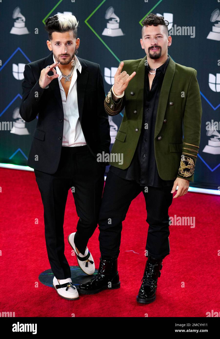 Ricky Montaner, left, and Mauricio Montaner, of Mau y Ricky, arrive at ...