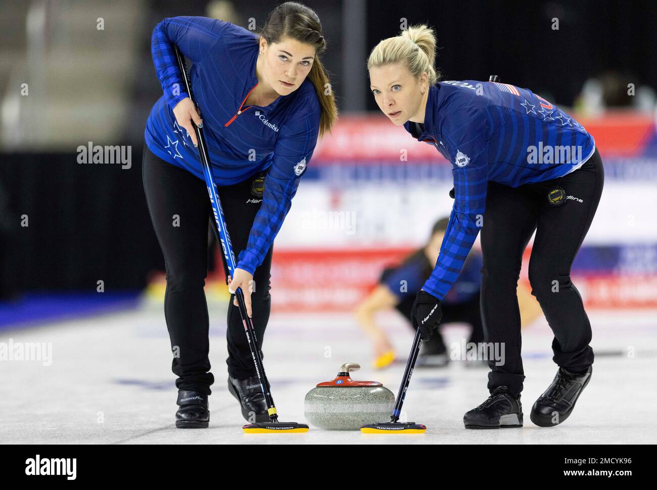 Team Peterson's Becca Hamilton, left, and Nina Roth sweep to curl the ...