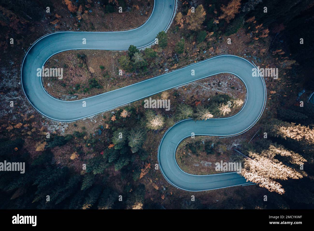 Aerial view of curved asphalt road on the mountain Stock Photo - Alamy