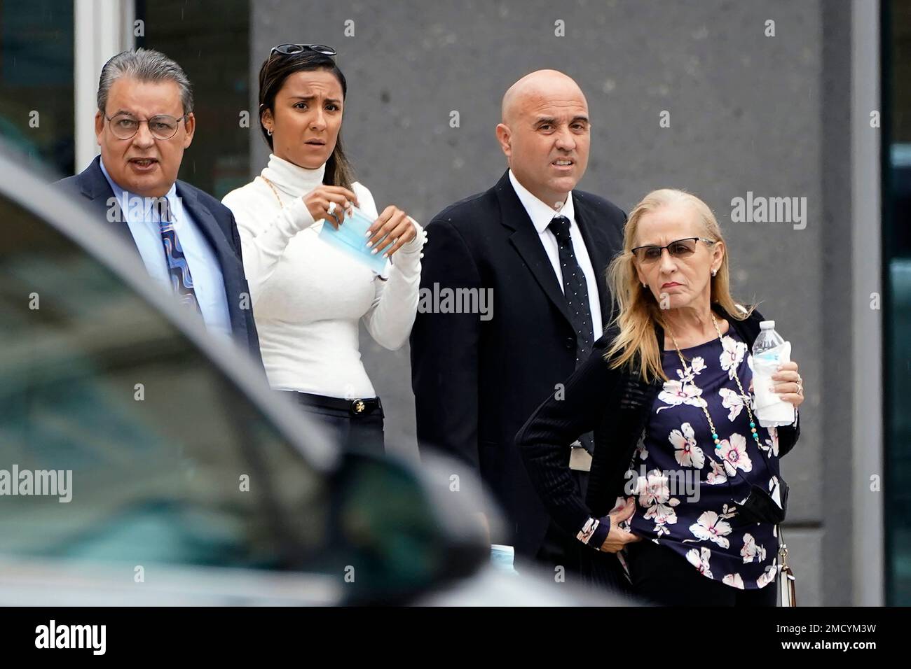 Former DEA agent Jose Irizarry, second from right, arrives at the ...