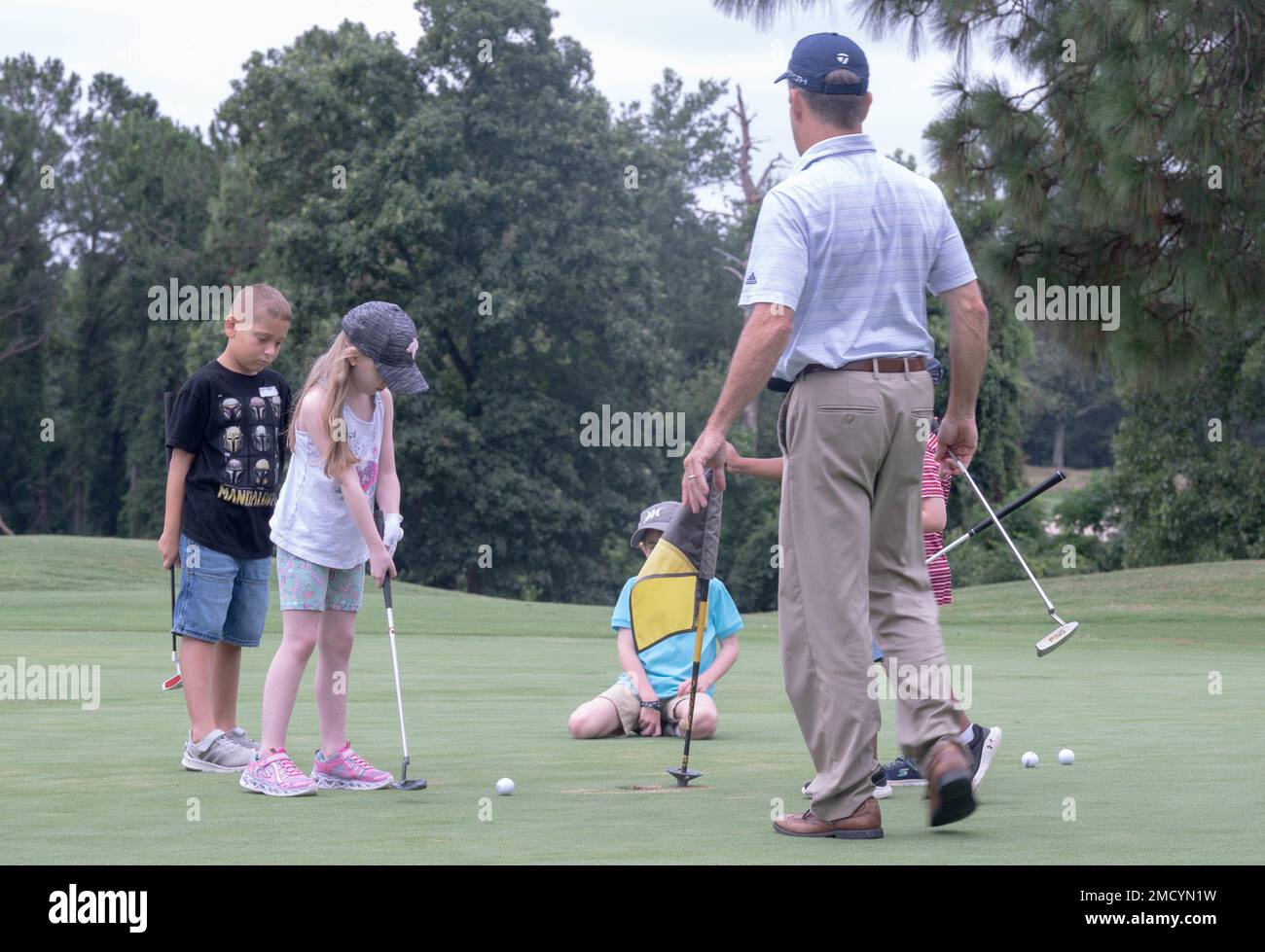 Children ages 6 to 9 learn to put at the Junior Golf Camp at the Fort ...