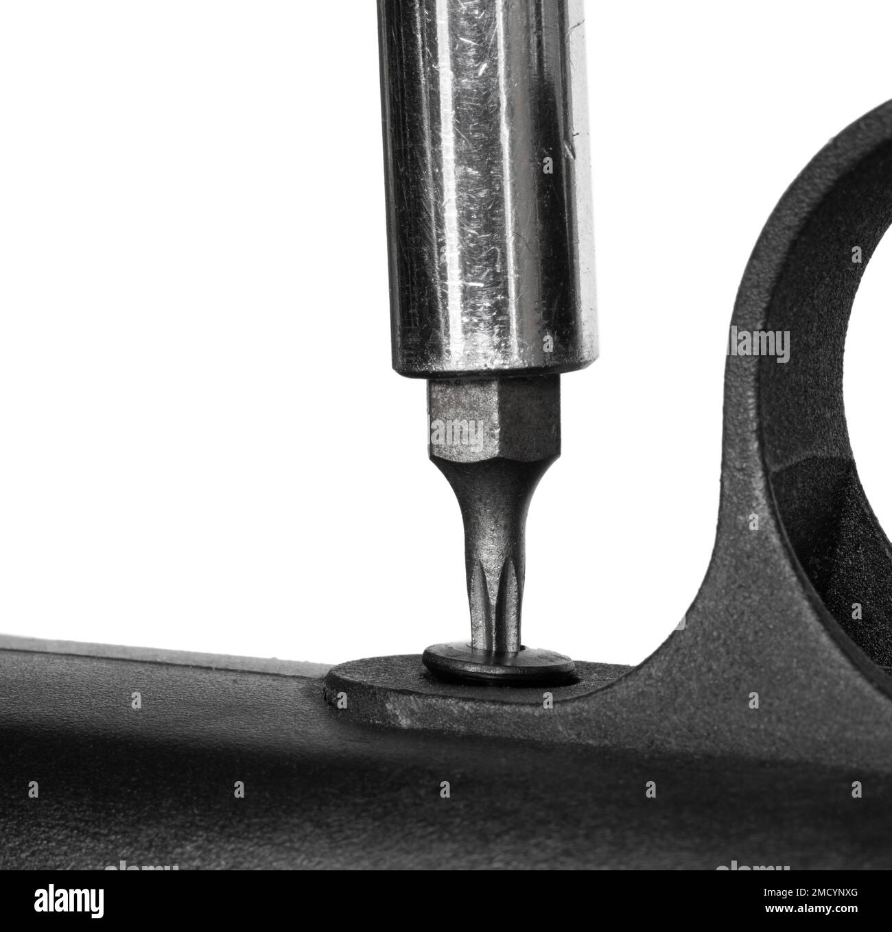 Trigger guard being removed on a rifle by a star headed screwdriver ...