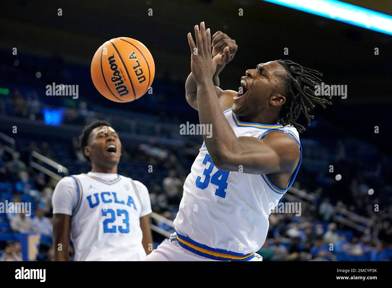 UCLA guard David Singleton, right, celebrates along with guard Peyton ...