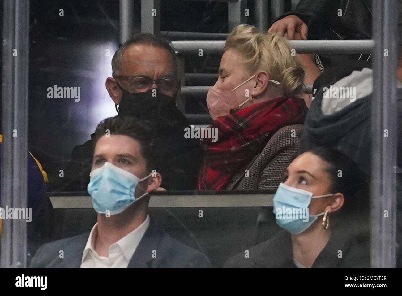 Actor Tom Hanks, top left, and musician Robin Thicke, bottom left, sit ...