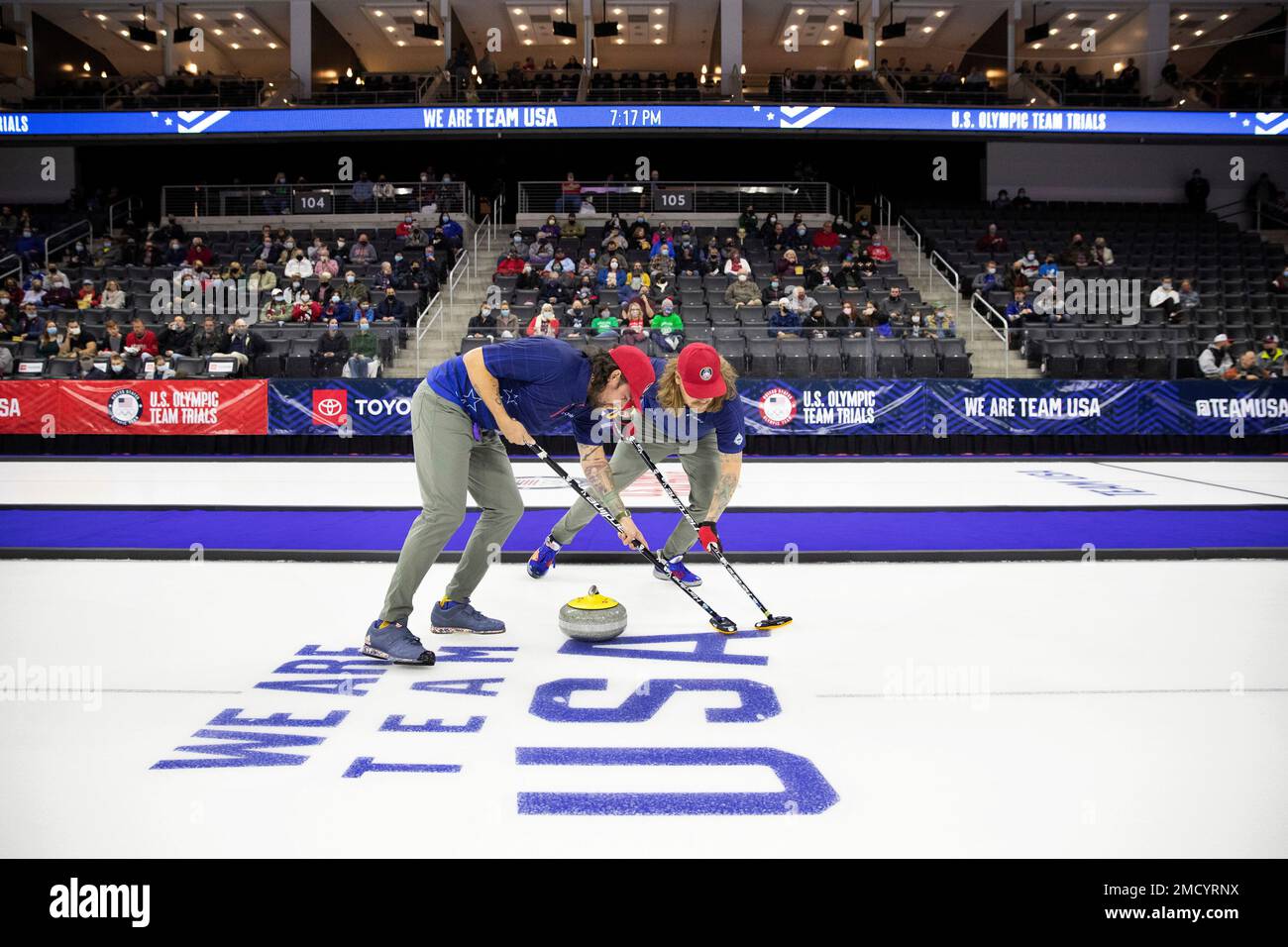 Team Shuster's Chris Plys, left, and Matt Hamilton sweep the rock while ...