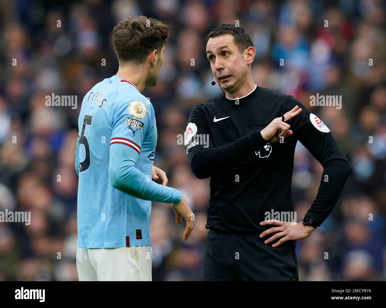 Manchester, UK. 22nd Jan, 2023. Referee David Coote talks to John ...