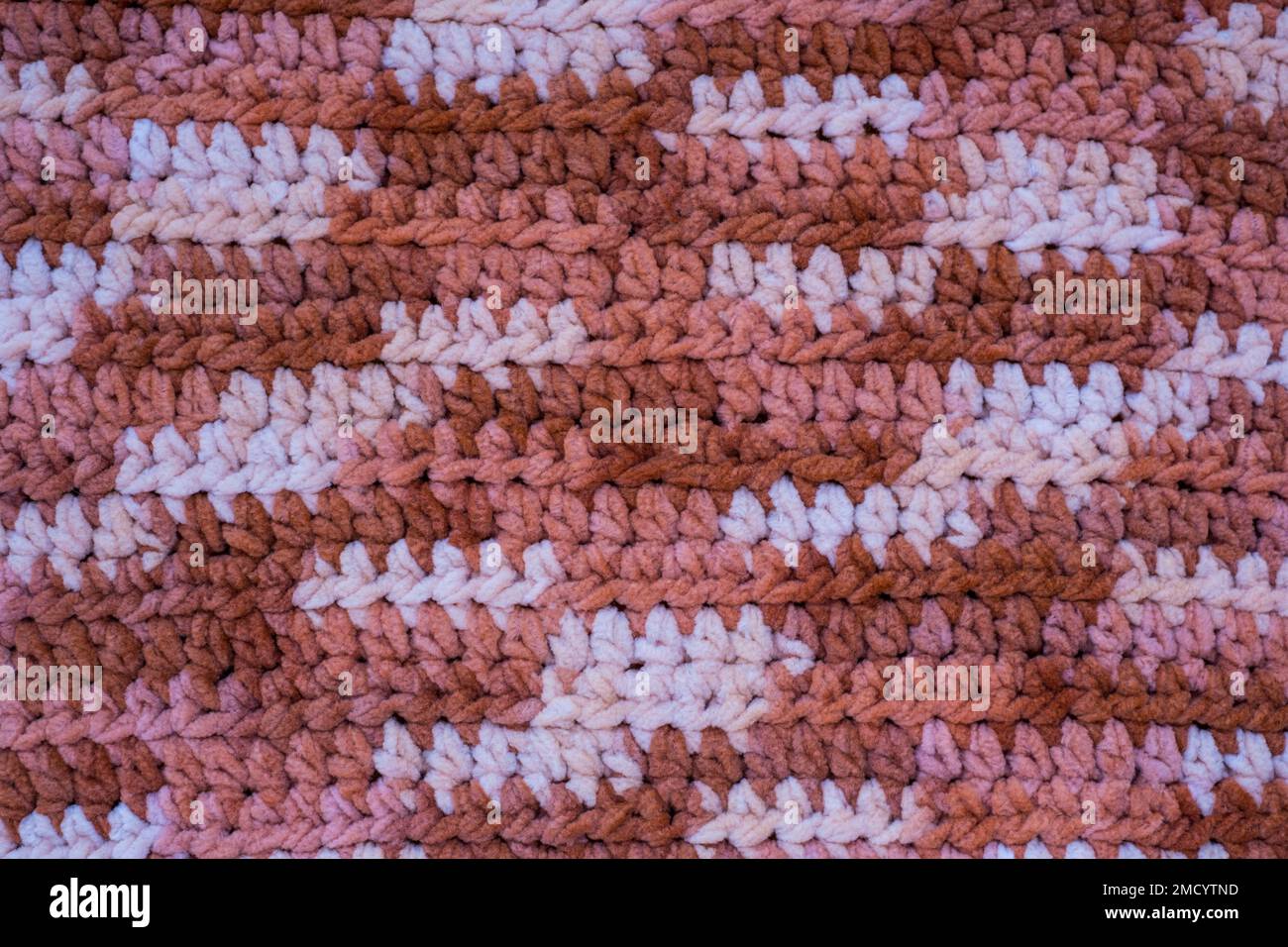 Hand-crocheted plaid. Geometric seamless knitted pattern. The texture ...