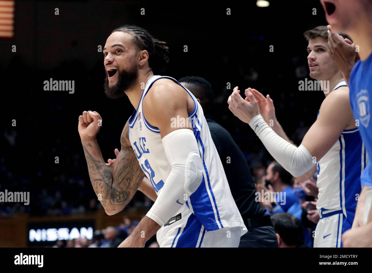 Duke forward Theo John (12) cheers his teammates after a good play ...