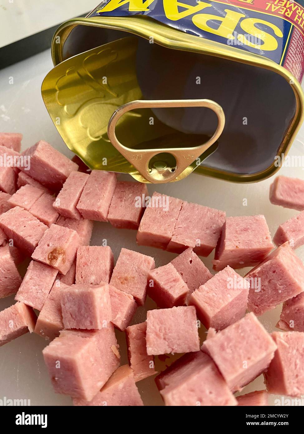 Still life of a tin of spam next to a diced loaf on a residential ...