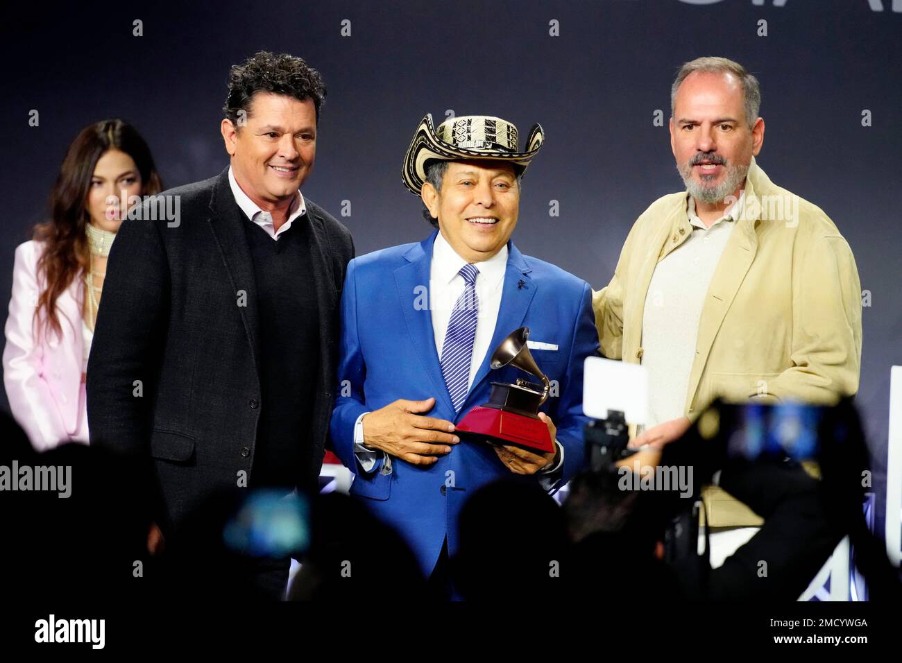 Recording artist Egidio Cuadrado, center, receives the Trustees award ...